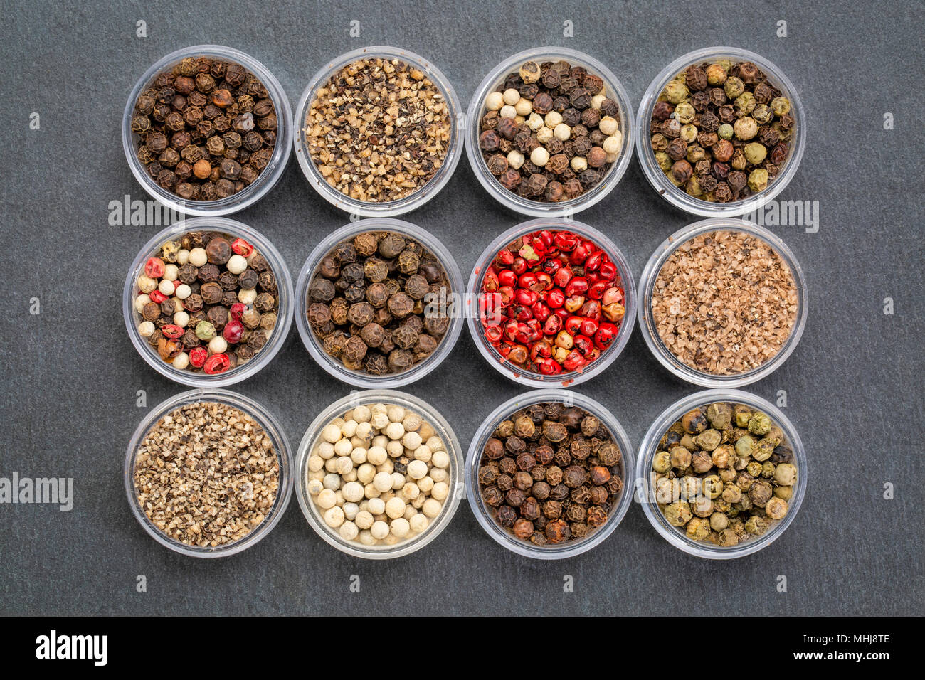 set of colorful peppercorn samples of the world on a slate stone Stock ...