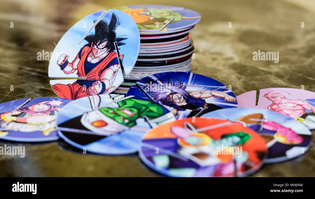 Colorful POGS of various cartoon characters Stock Photo - Alamy