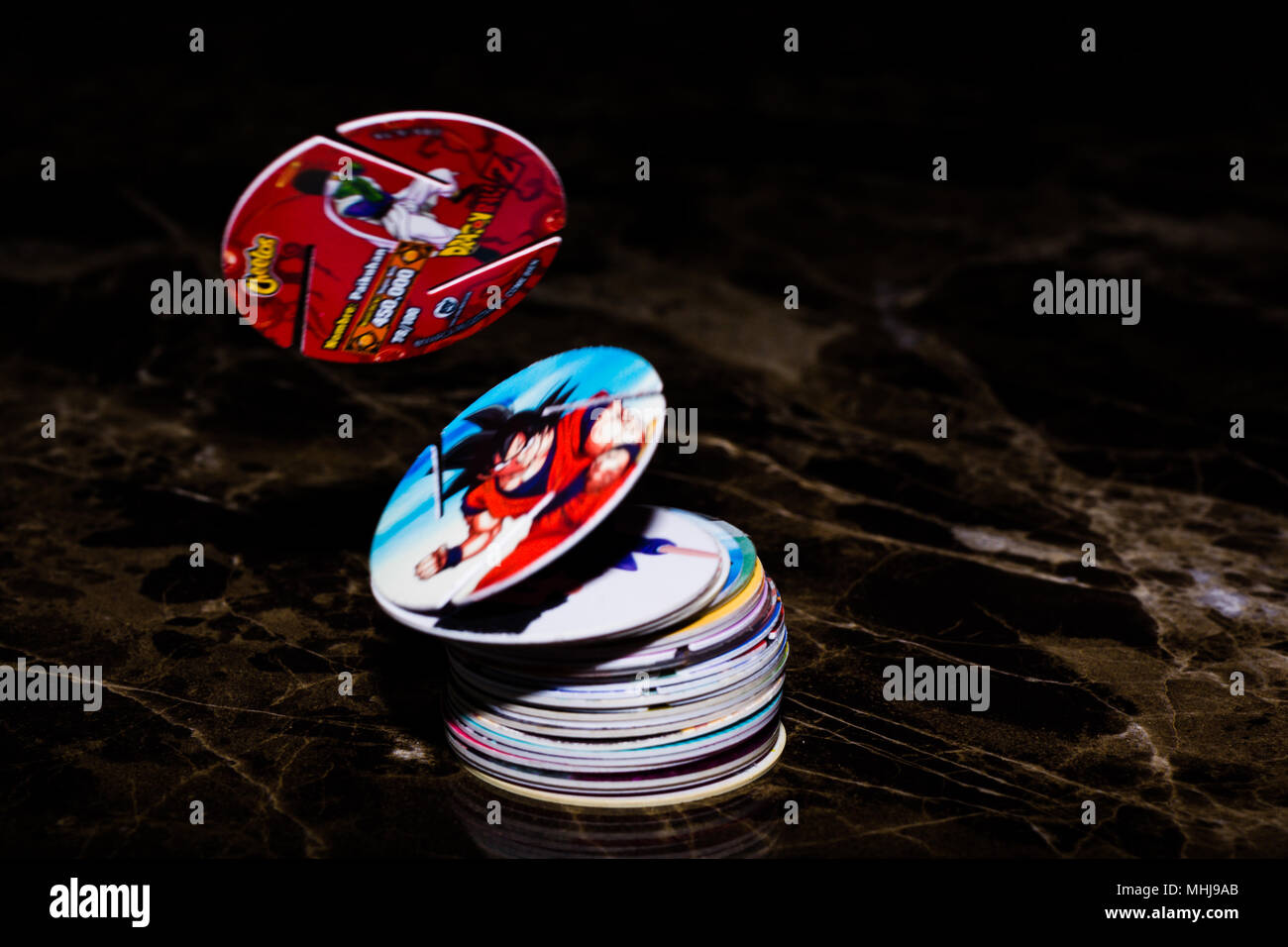 Colorful POGS of various cartoon characters Stock Photo - Alamy