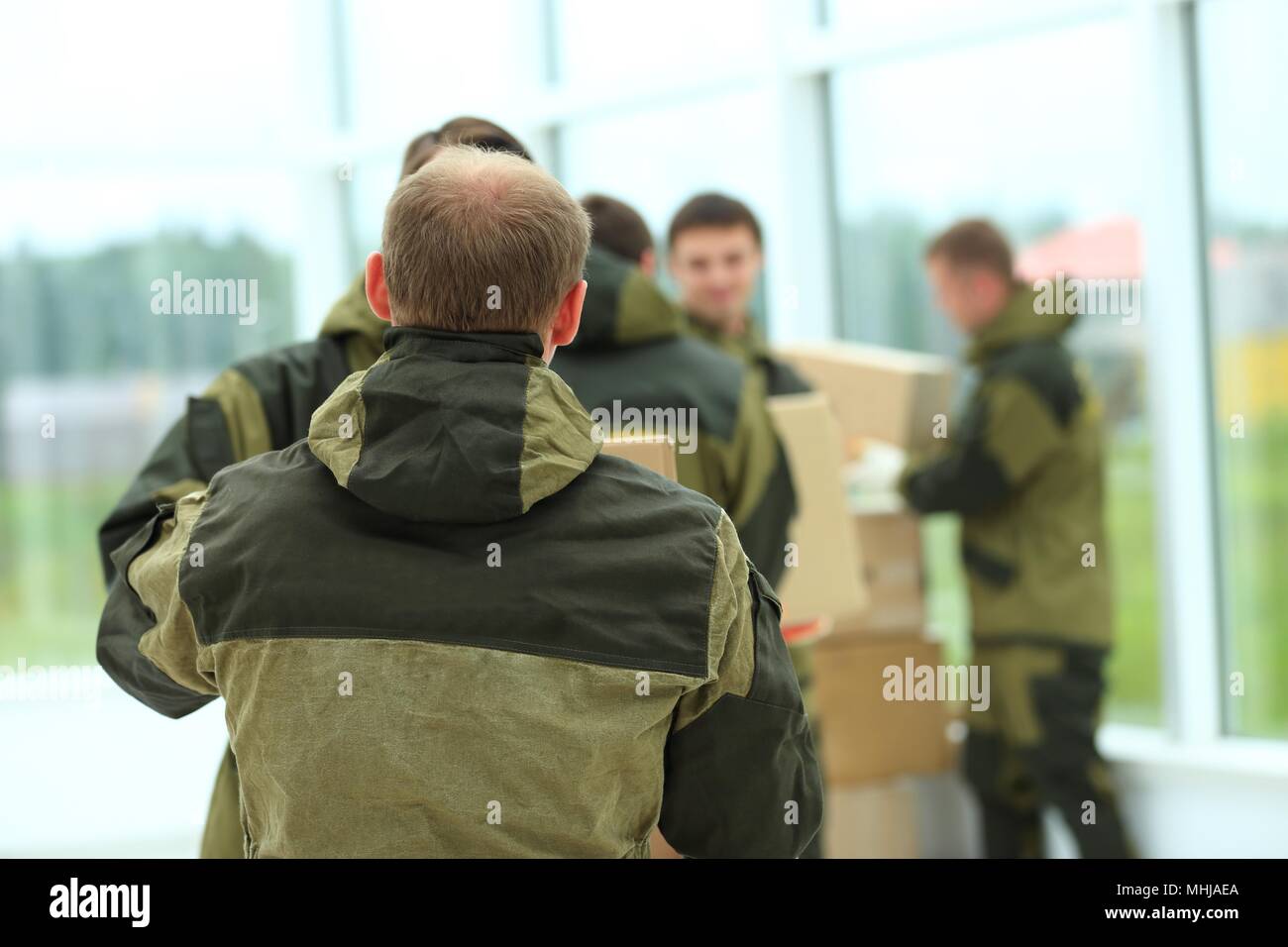 blurred image working with boxes of building materials Stock Photo - Alamy
