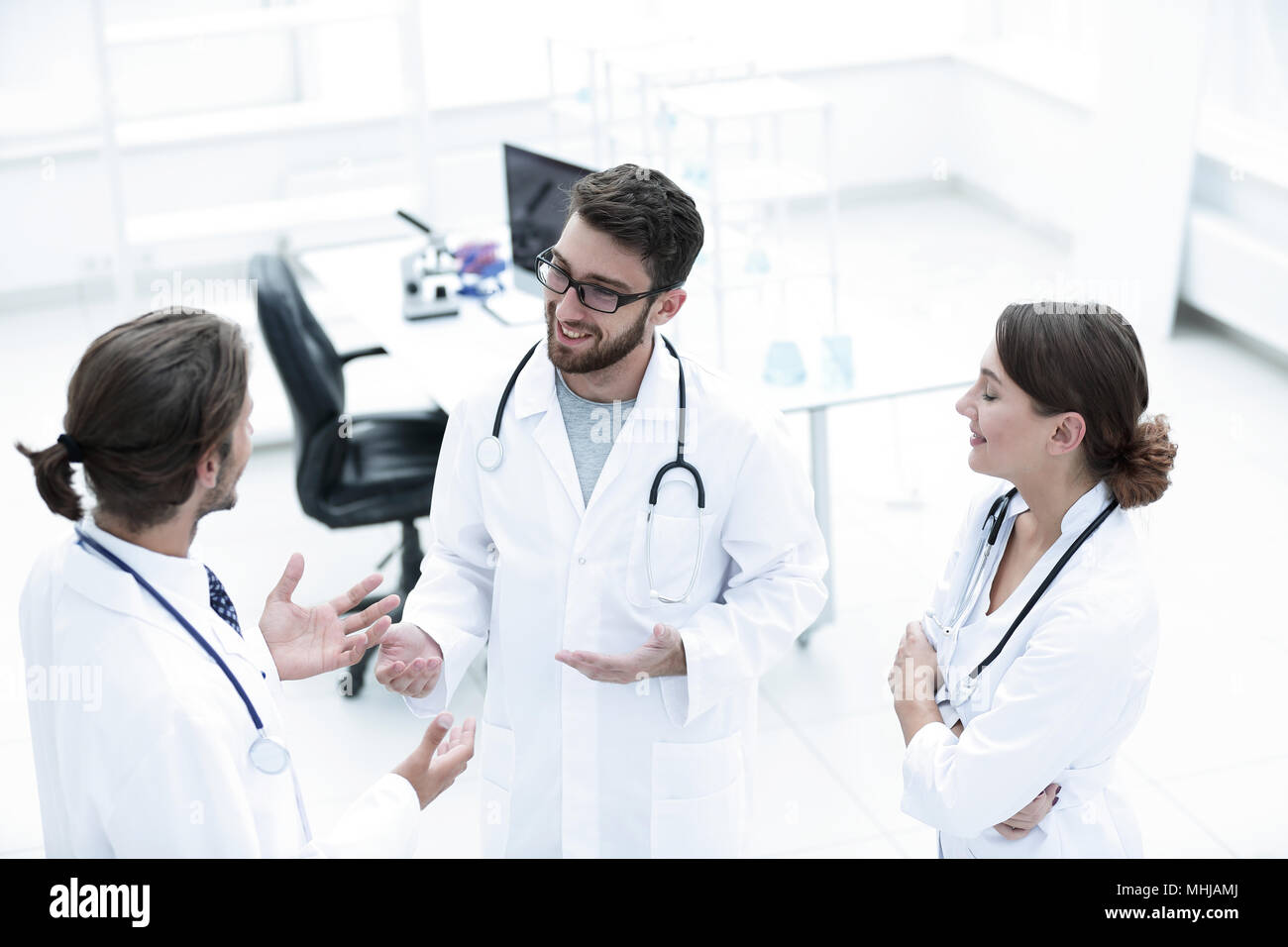 Group of doctors talking Stock Photo - Alamy