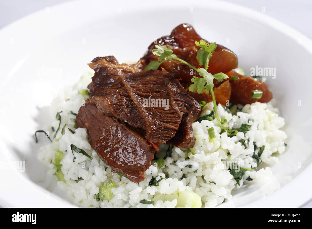 beef tendon over rice Stock Photo - Alamy