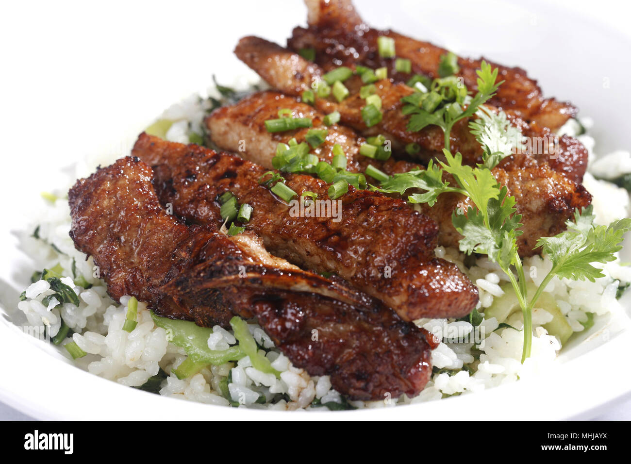 pork chop over rice Stock Photo - Alamy