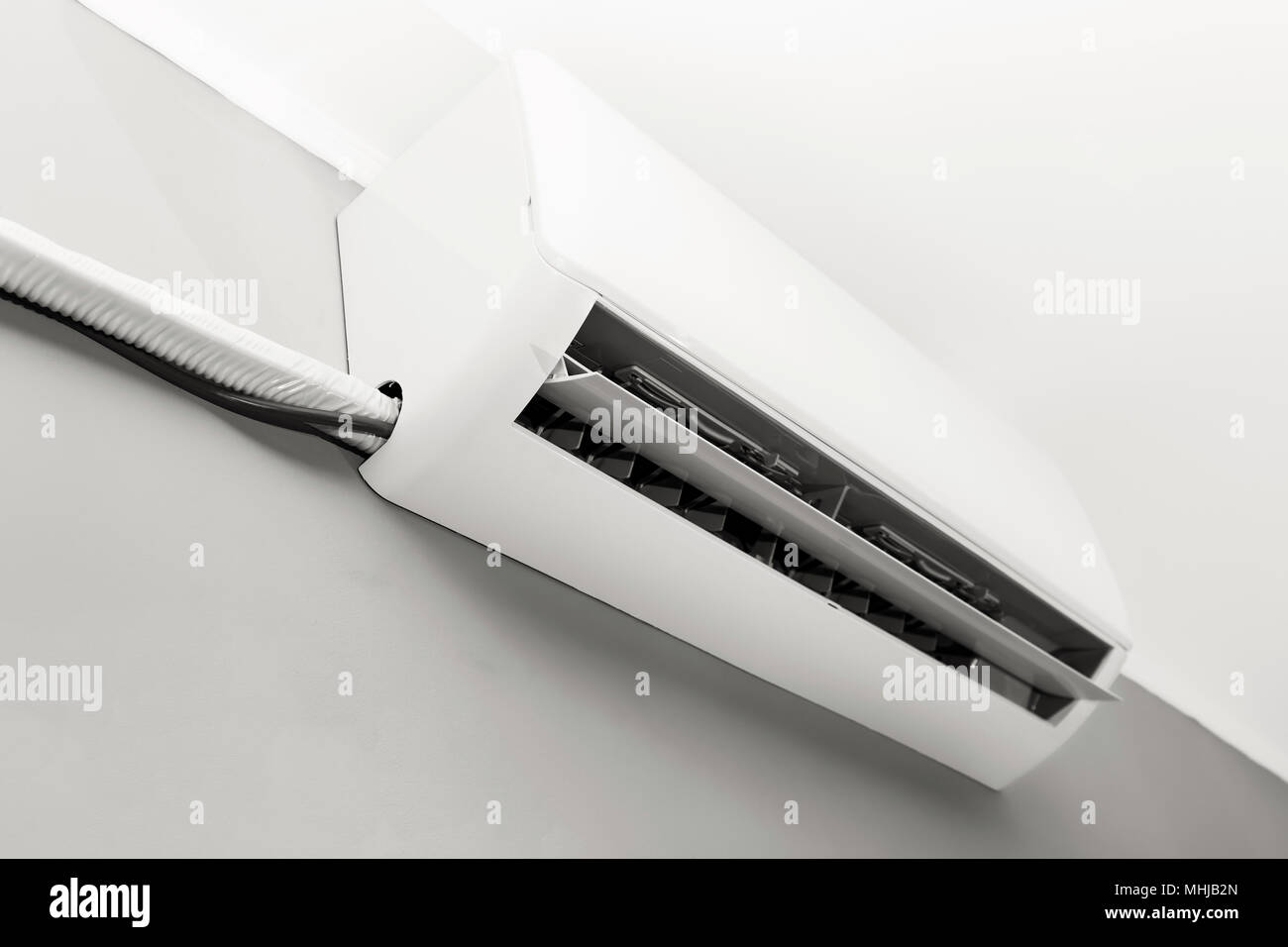 Split air conditioner on wall hi-res stock photography and images - Alamy