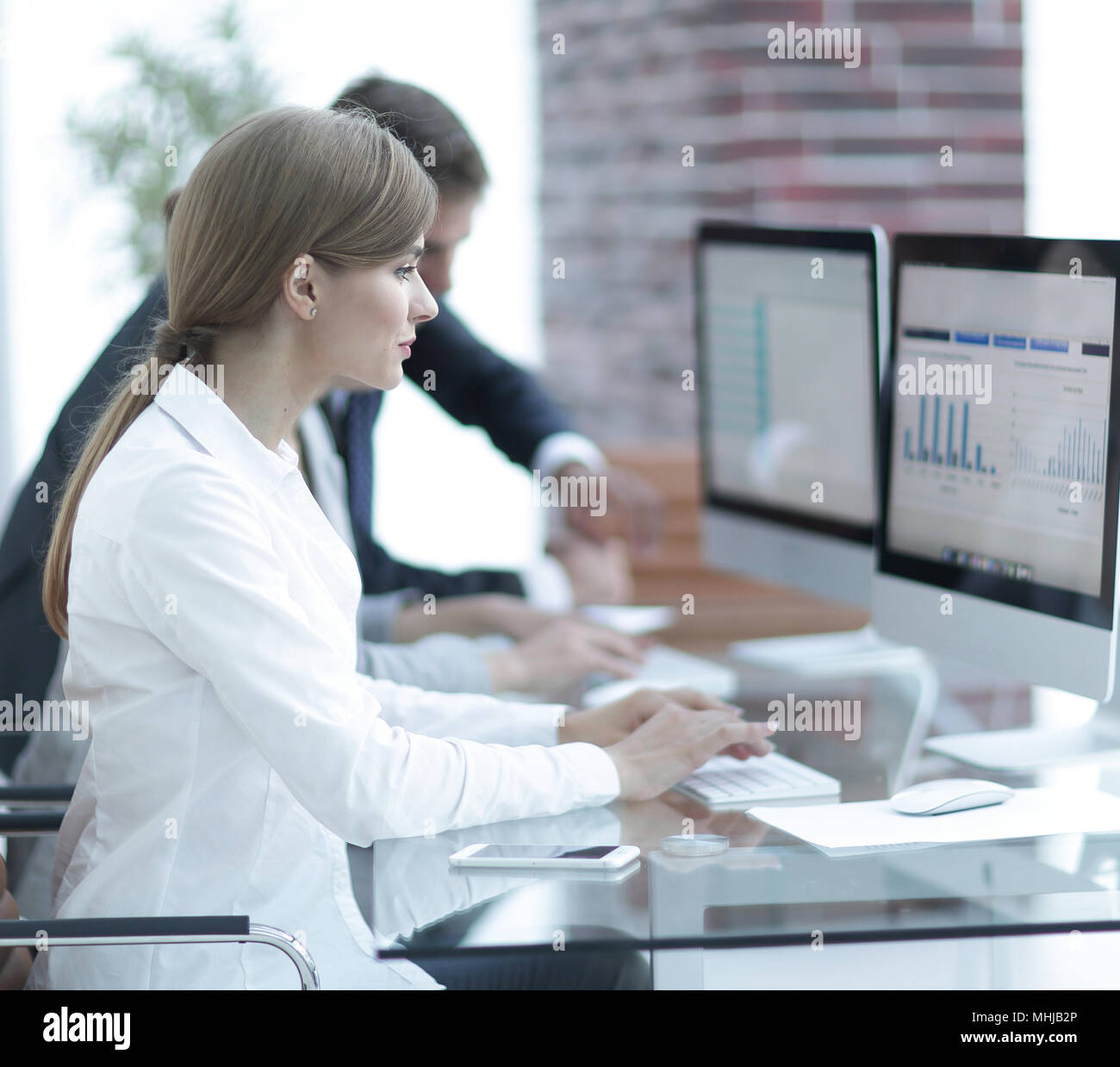 business team working on computers with financial data Stock Photo - Alamy