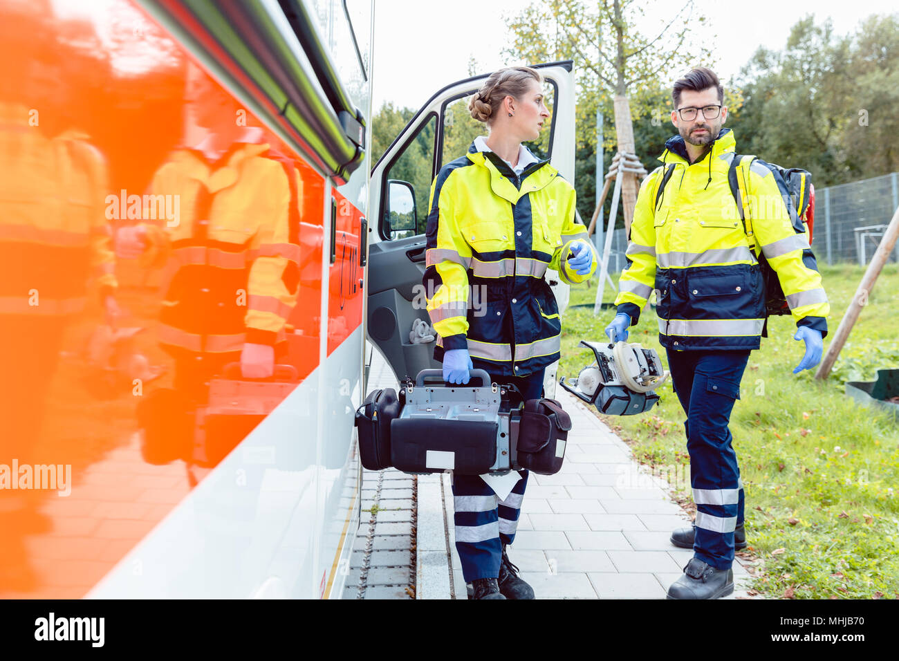 Paramedic nurse and emergency doctor at ambulance Stock Photo - Alamy