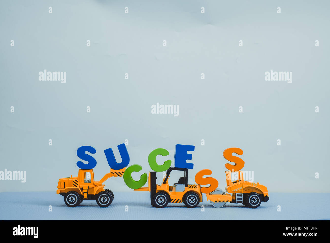 Mini forklift bulldozer truck and road roller machine with text SUCCESS ...