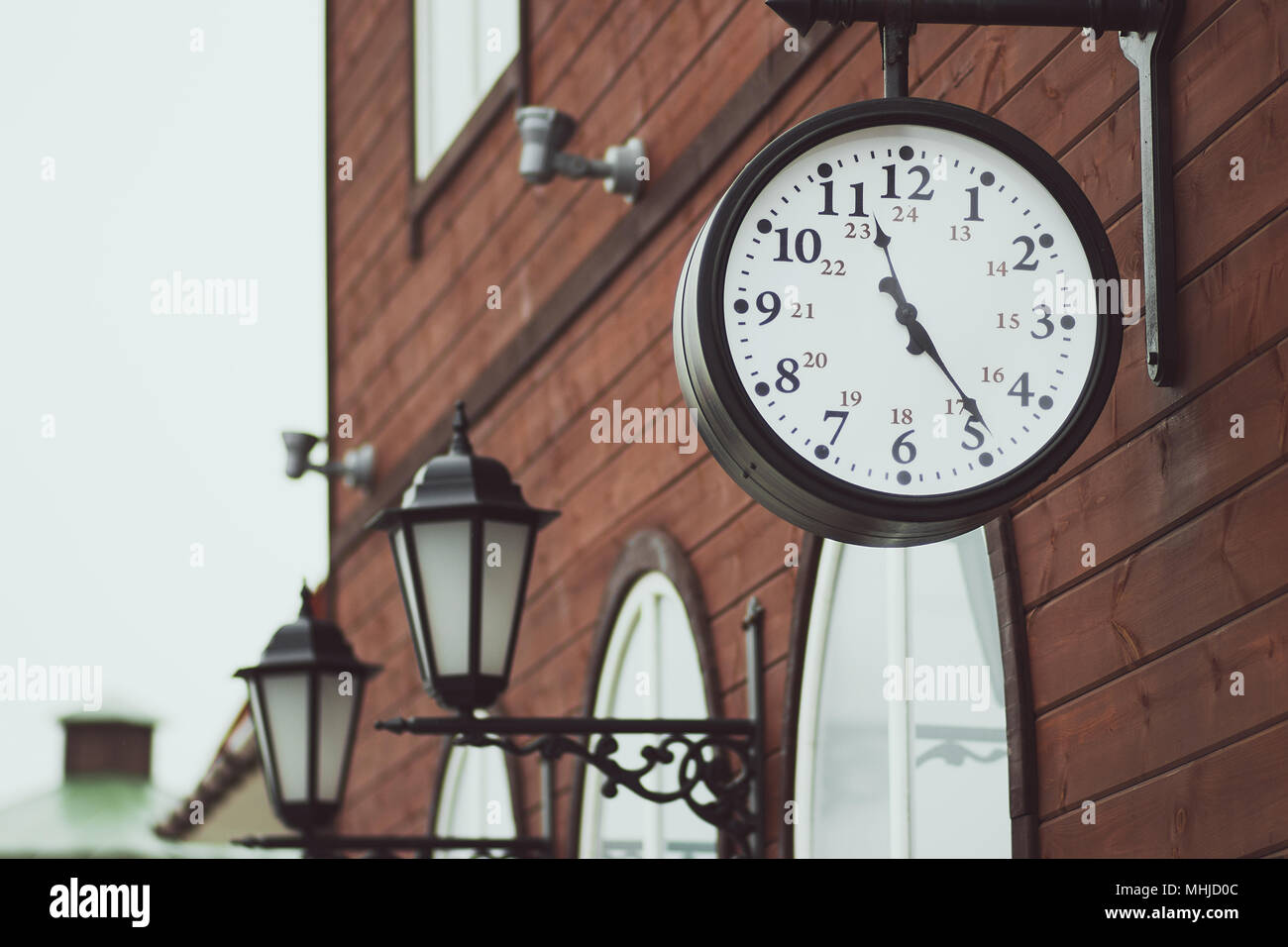 Urban historical architecture with vintage clock in street in London ...