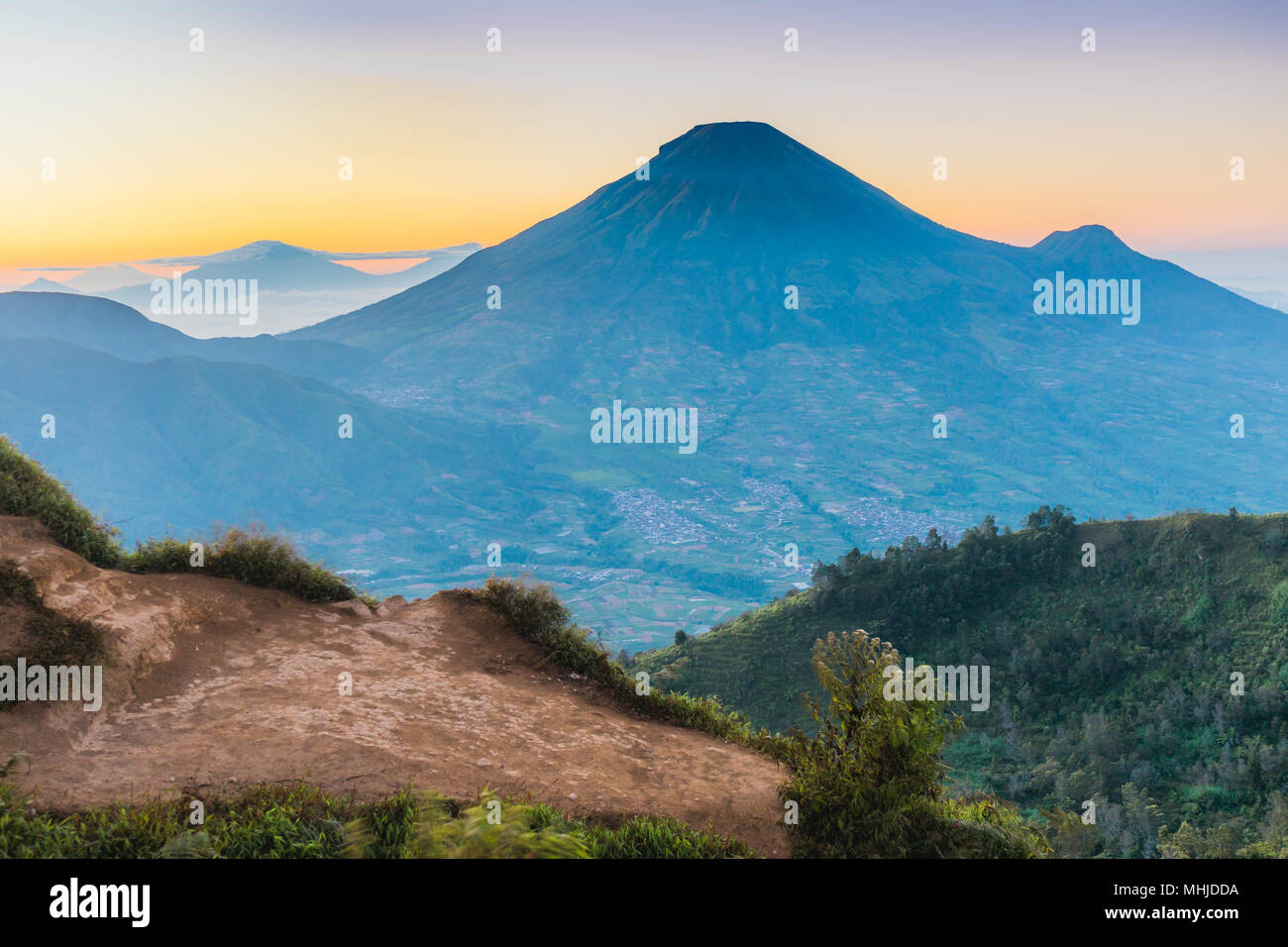 colorful sunrise from Sikunir Peak, Dieng with Sindoro mountain view ...