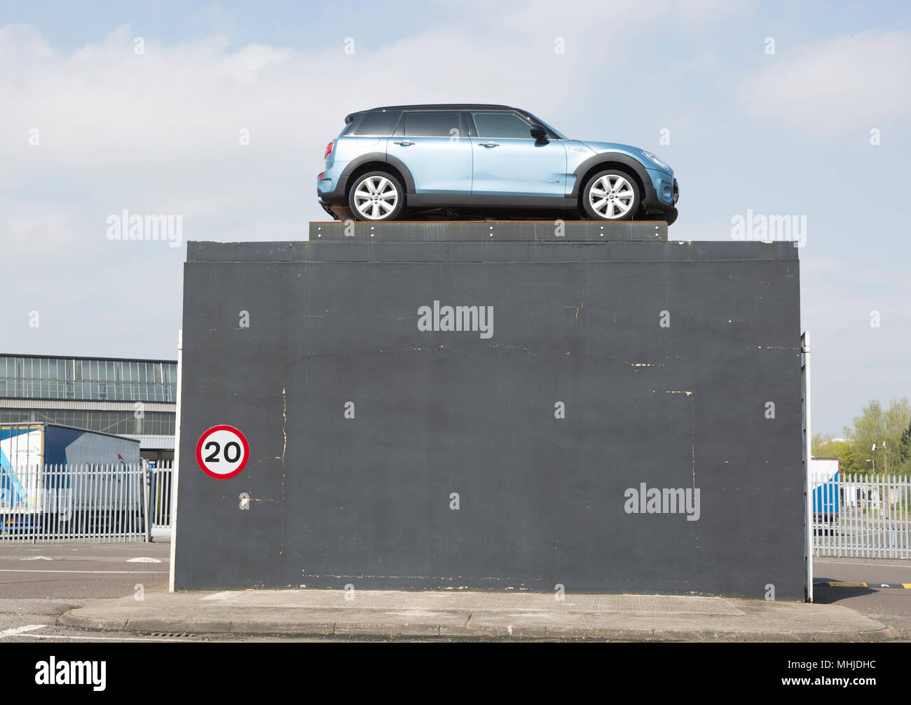 Car at entrance to BMW panel production factory Mini Plant, Stratton St ...