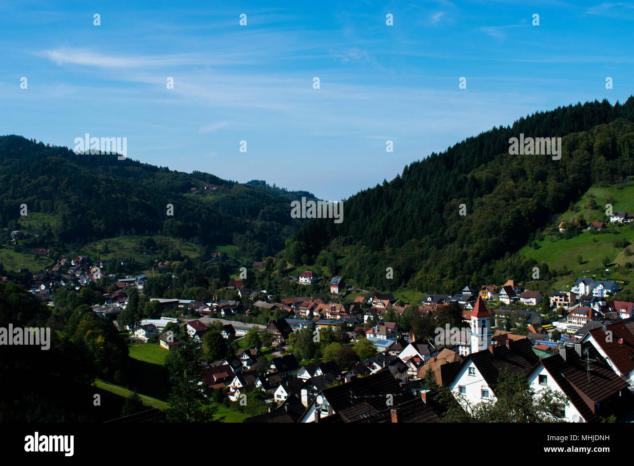 View of a beautiful village with mountains and vineyards in Germany ...
