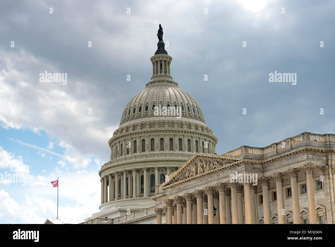 Washington DC Capitol dome detail with waving american flag Stock Photo ...