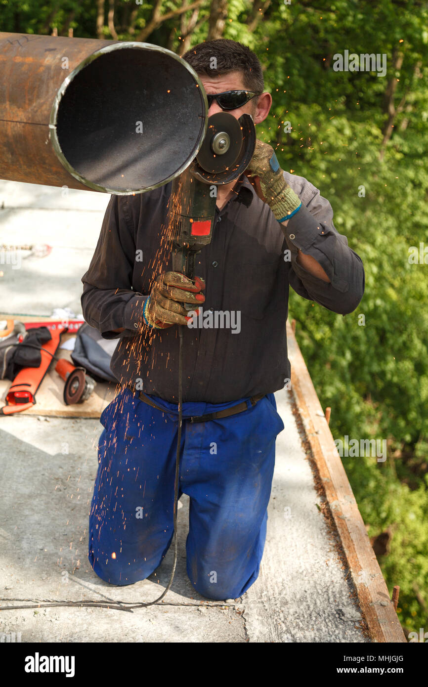 Cutting steel heavy industry by electric flex Stock Photo - Alamy