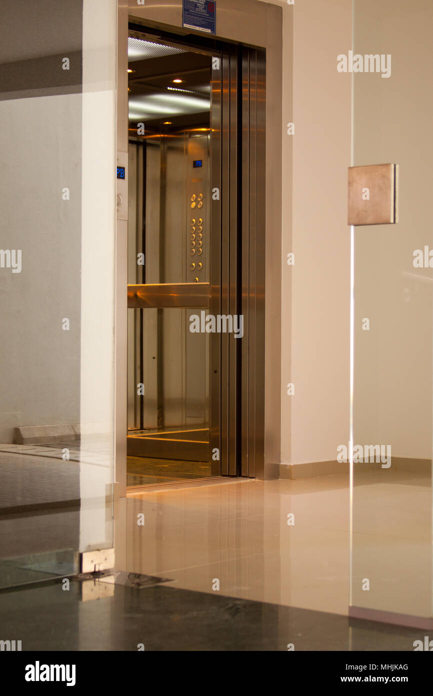 Elevator in the hall of a building Stock Photo - Alamy