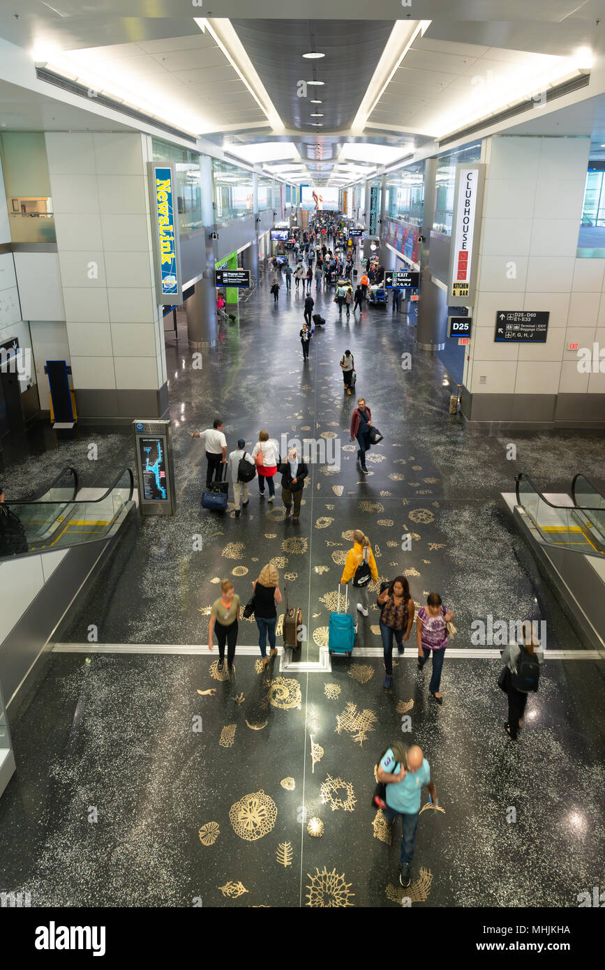 "A Walk On The Beach" bronze art on the floor Concourse D of Miami ...