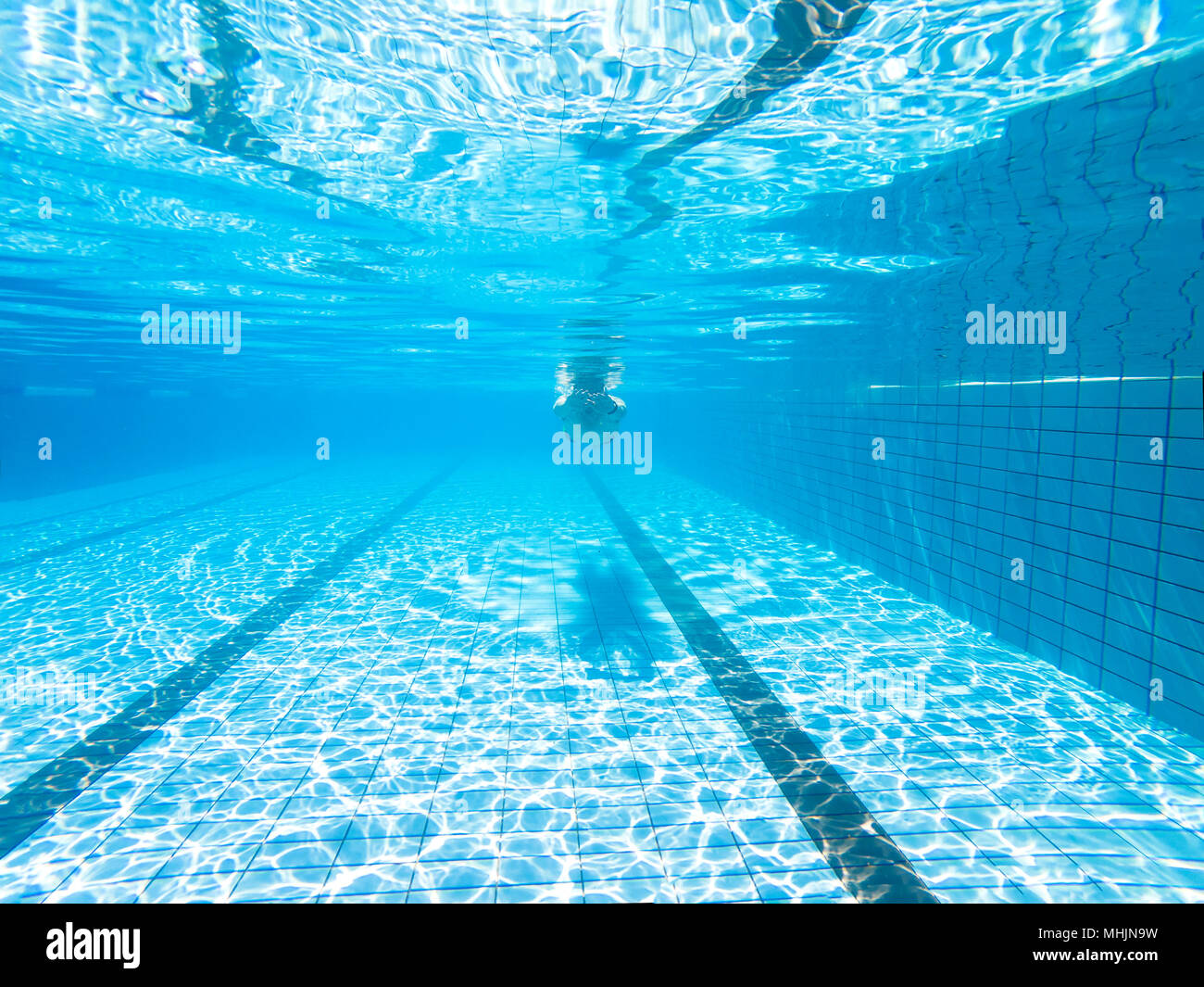 Underwater view of man in swimming pool Stock Photo - Alamy