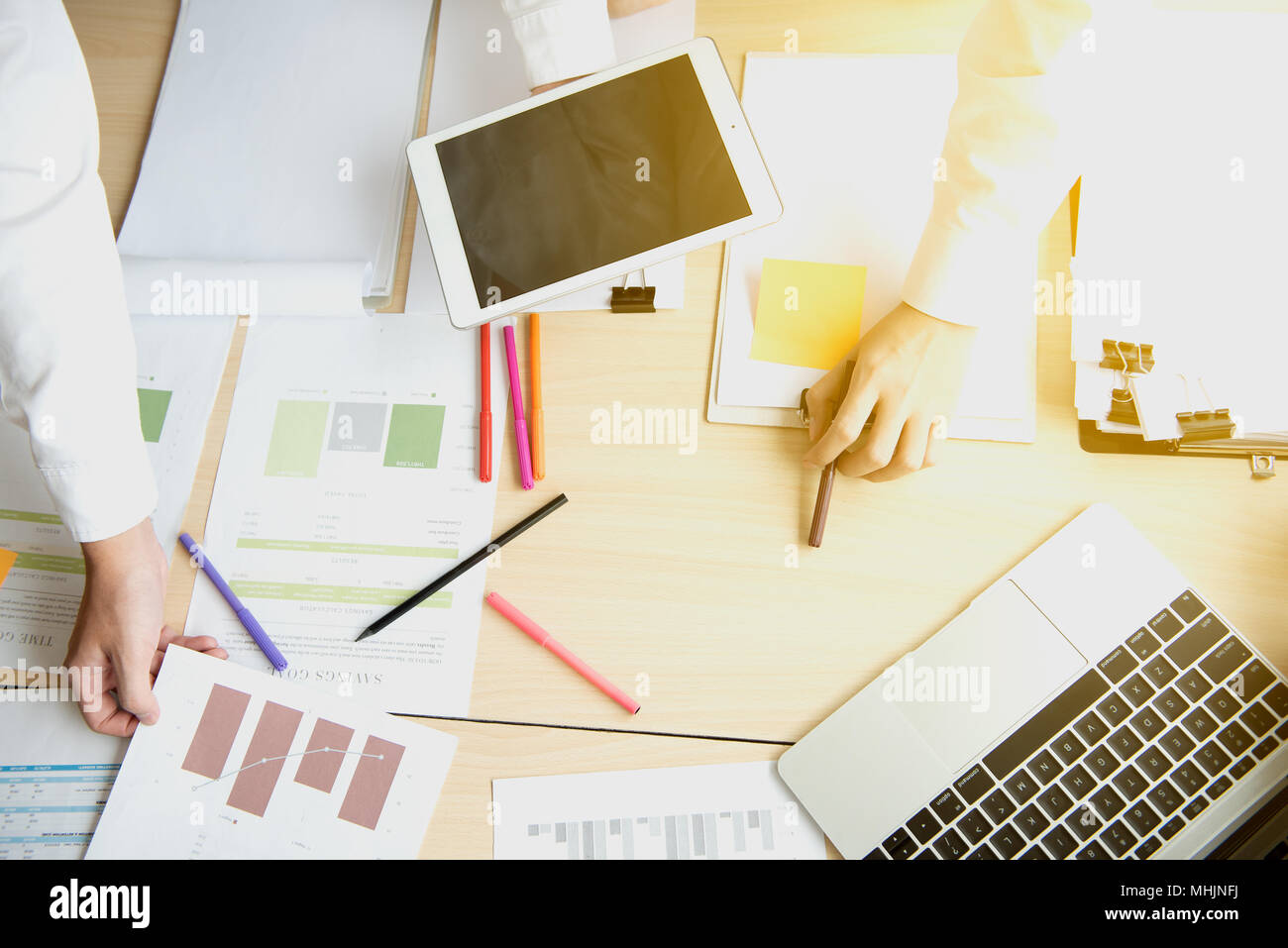 business group working check chart and paper data with laptop on desk ...