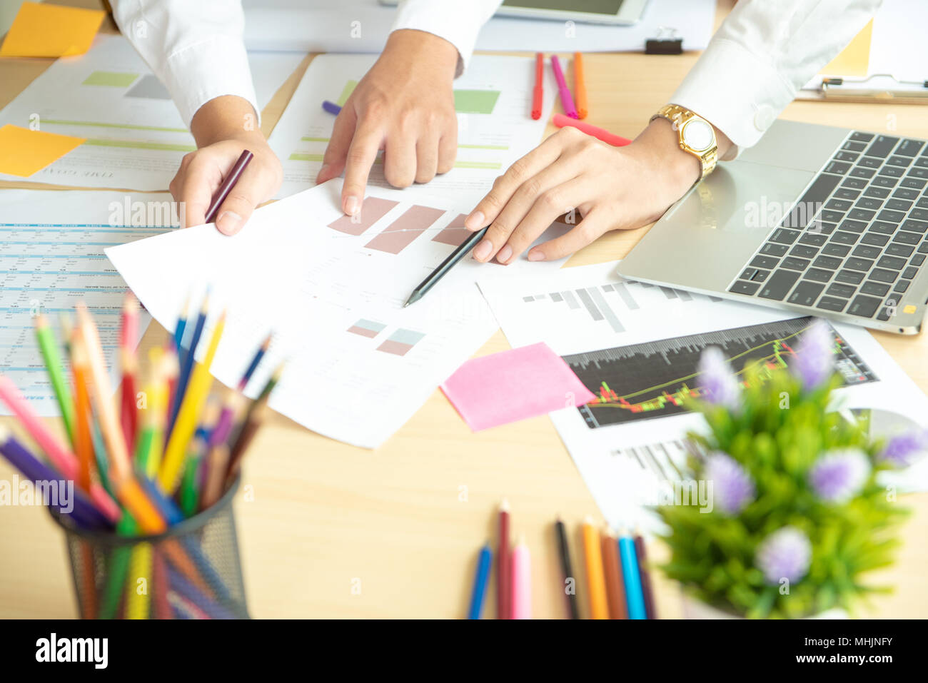 business group working check chart and paper data with laptop on desk ...
