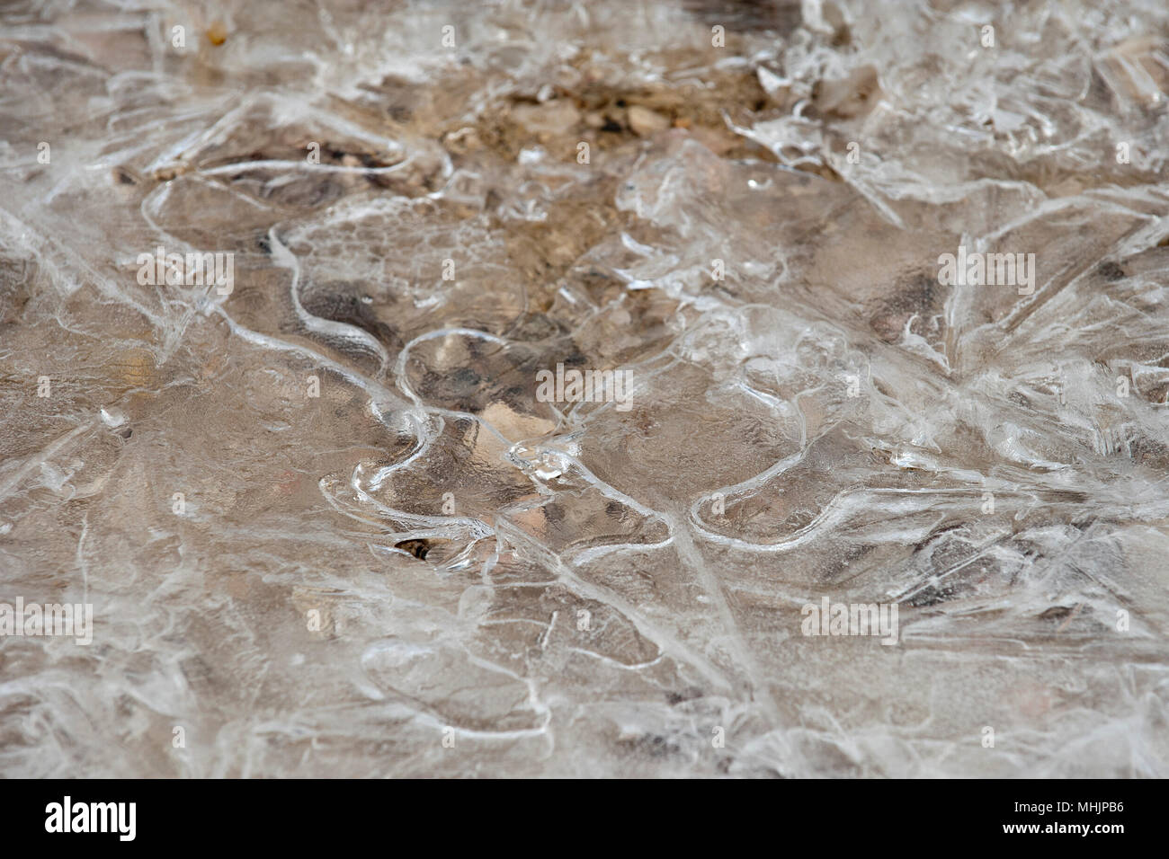 Natural Ice crystal background frozen lake river creek Stock Photo - Alamy