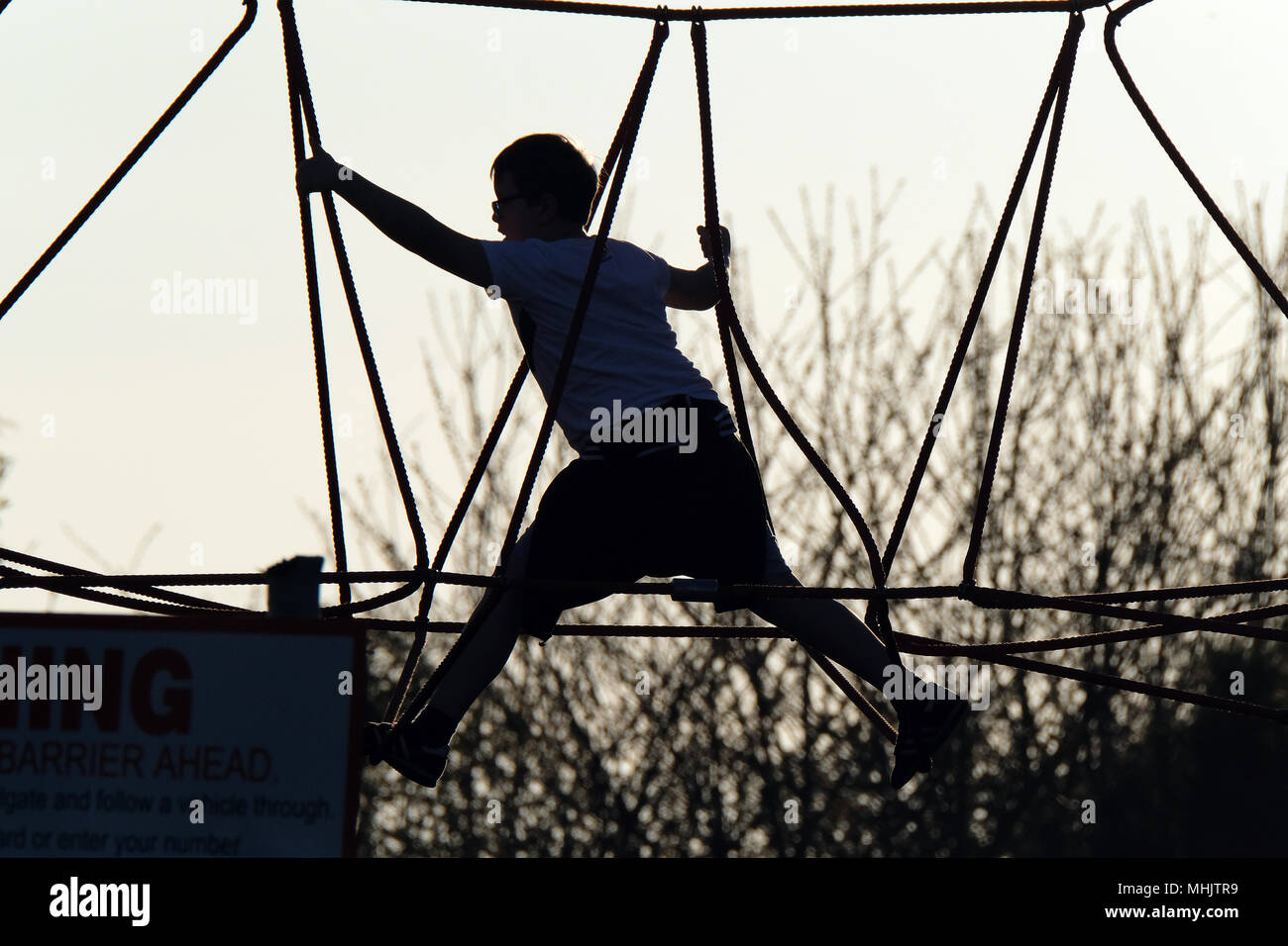 Child playing climbing pole hi-res stock photography and images - Alamy