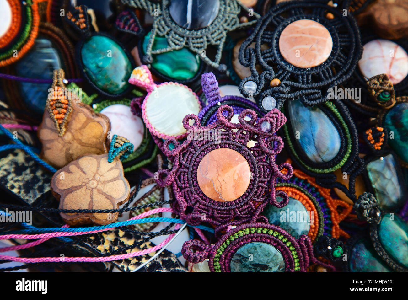 collection of natural stone handmade pendants Stock Photo - Alamy
