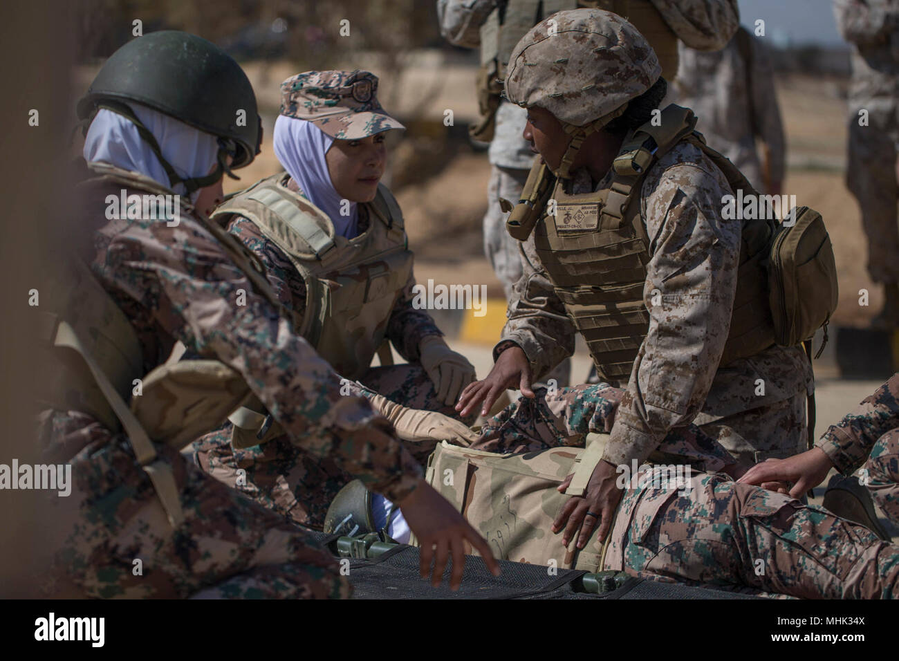 U.S. Navy Hospital Corpsman 3rd Class Joanna Rolle (right), a member of ...