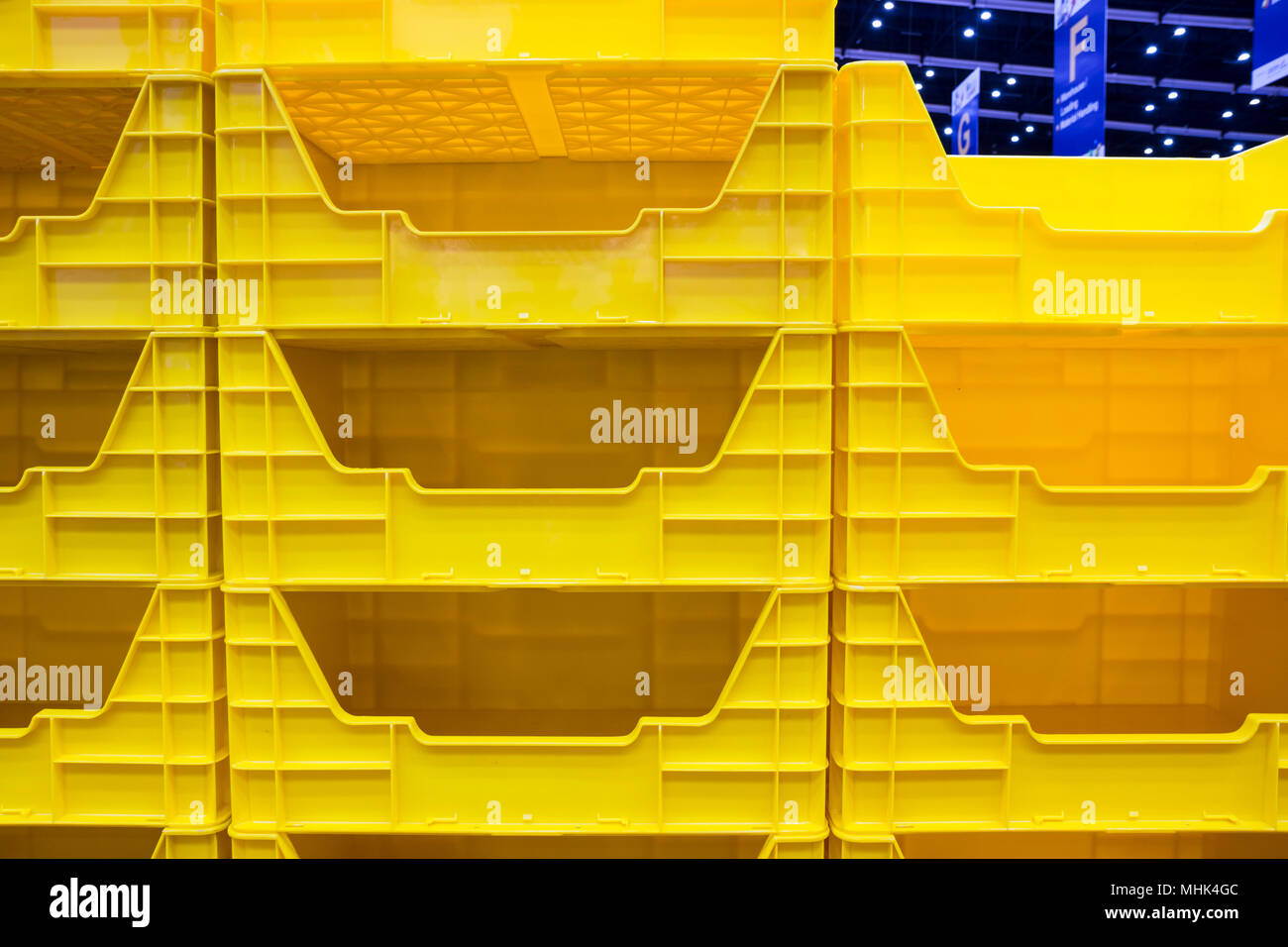 Yellow plastic box shelf for warehouse ; close up Stock Photo - Alamy