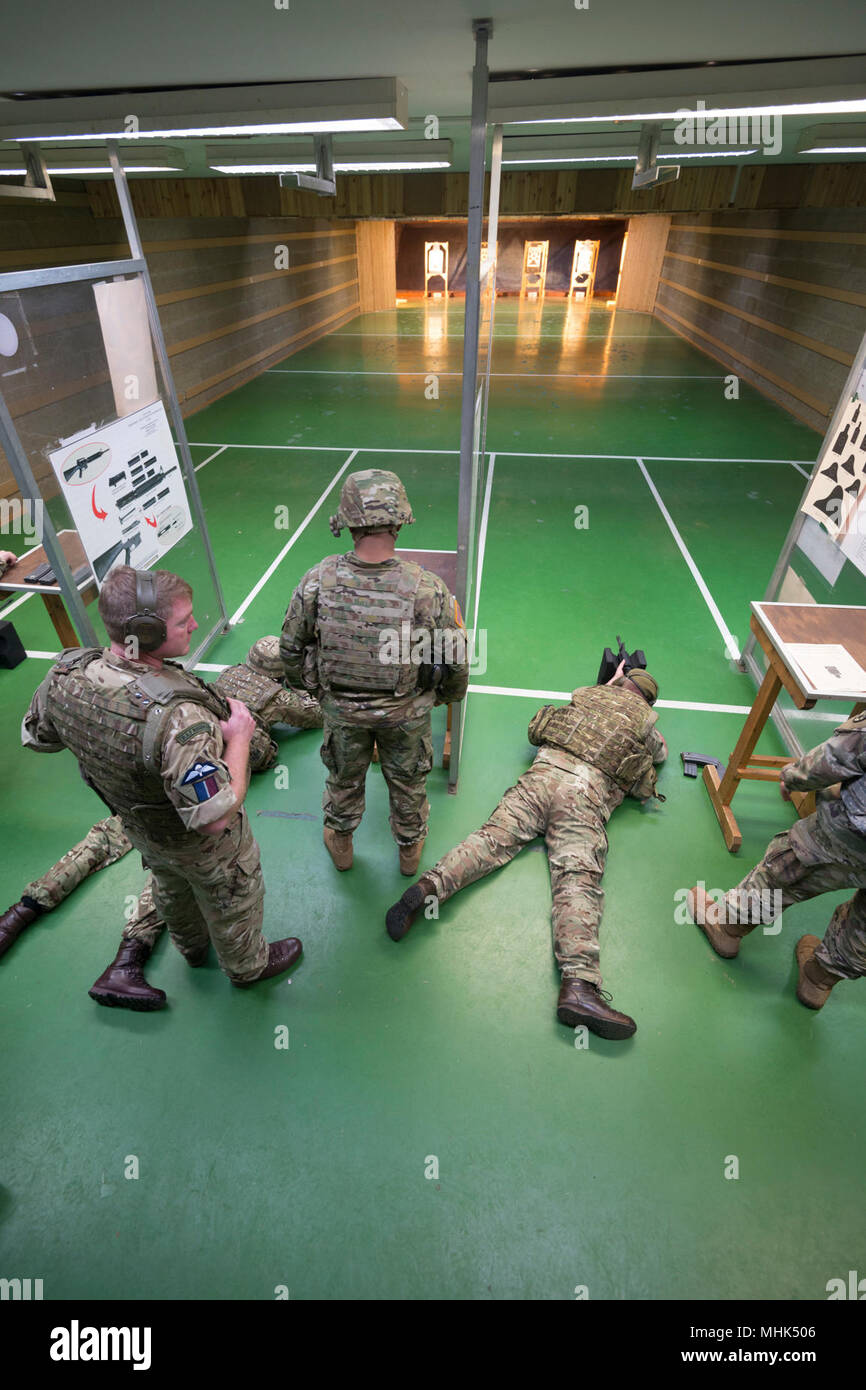 Members of the U.K. forces shoot with the M4 carbine in the prone ...