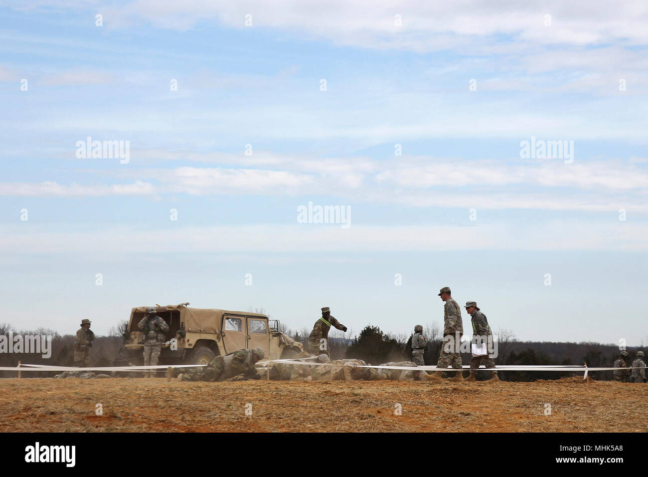 U.S. Army Reserve Soldiers conduct low crawling techniques in response ...