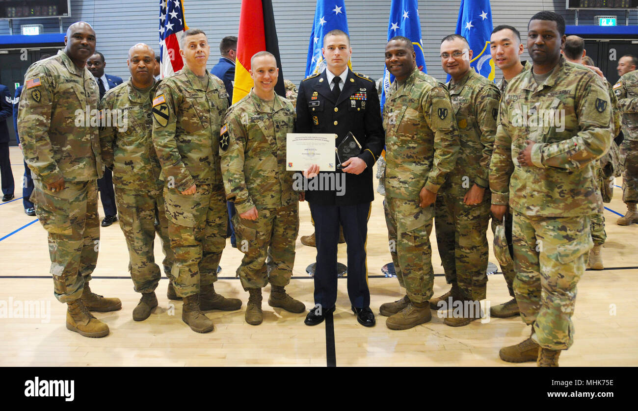 U.S. Army Staff Sgt. Jacob Rau poses with senior leaders from 21st ...
