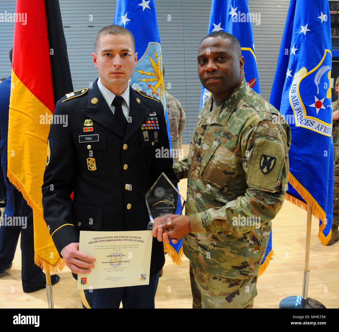 U.S. Army Staff Sgt. Jacob Rau, left, 21st Special Troops Battalion ...