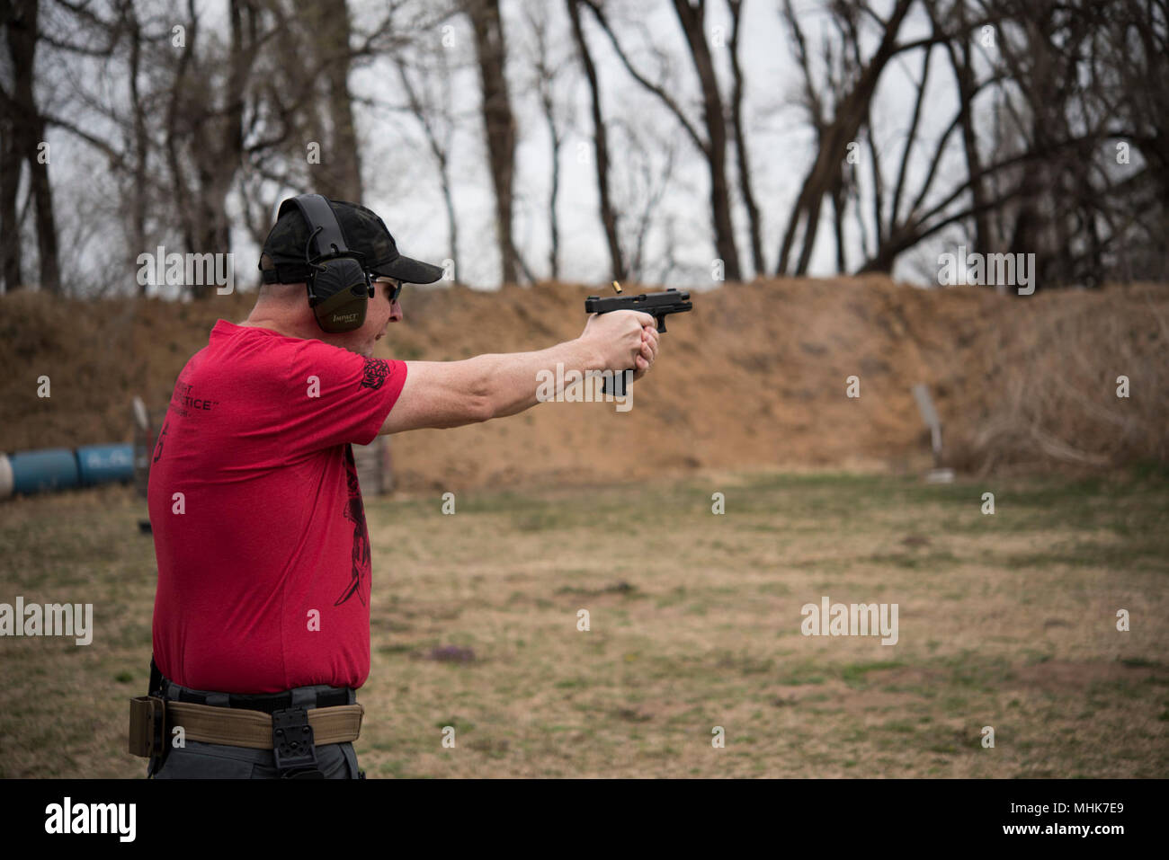 A Vance Chisholm Trail shooter fires his handgun during a Steel ...