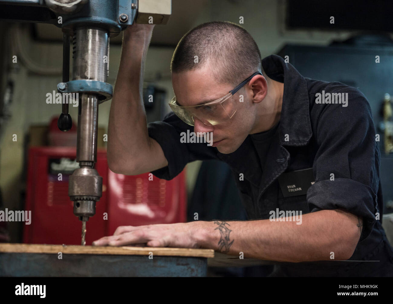 PACIFIC OCEAN (March 26, 2018) Fireman Ryan Mixon uses a drill press in ...