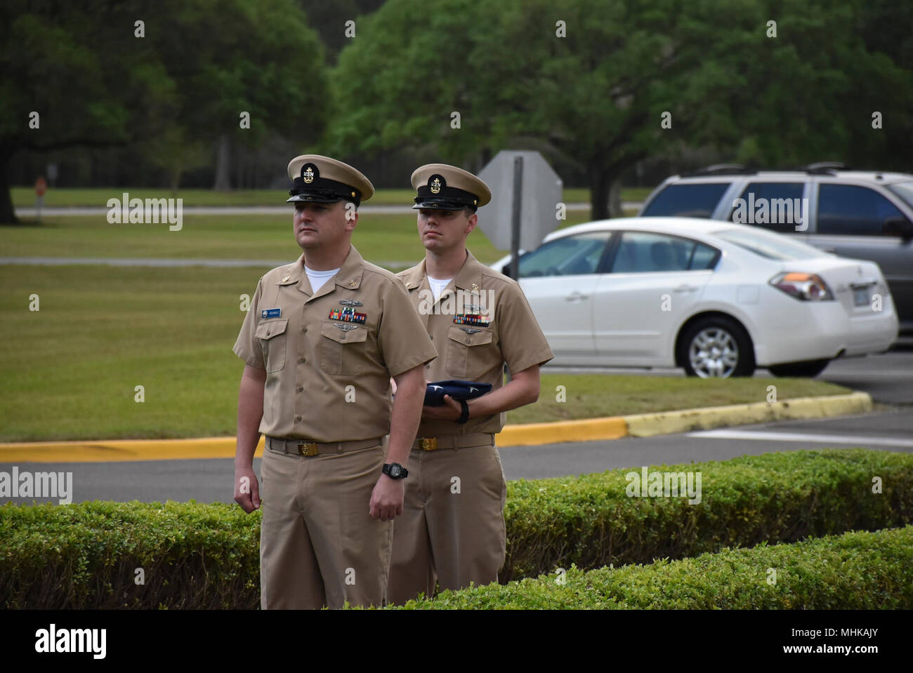 AGC Jason Archibald (left) and AGC Chad Collier (right) carry the flag ...