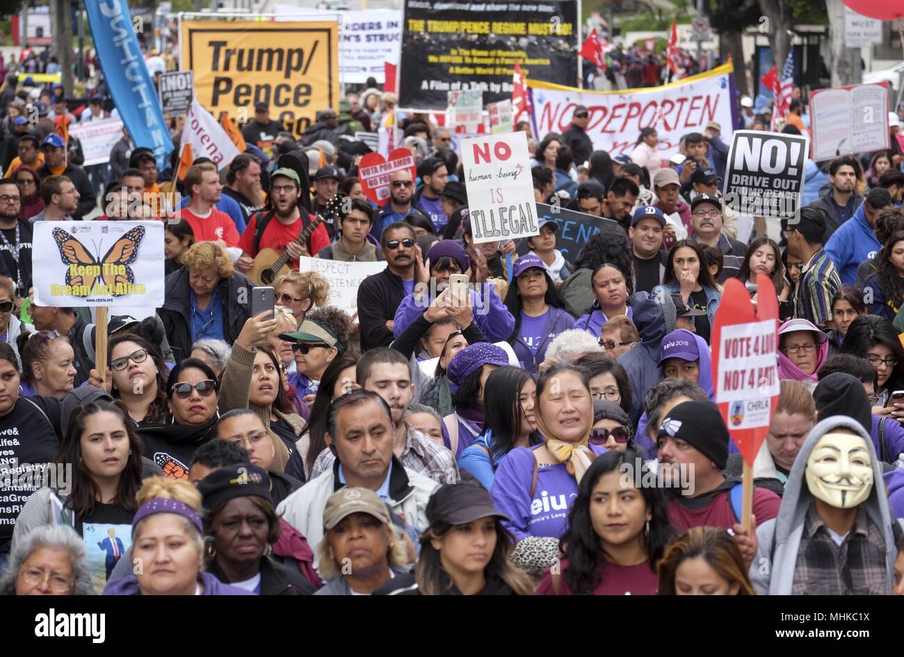 Los Angeles, California, USA. 1st May, 2018. Protesters carry signs ...