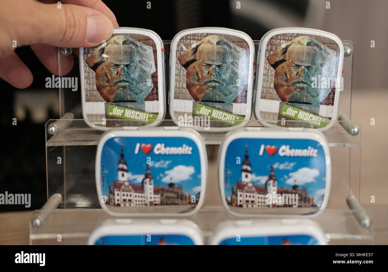 27 April 2018, Germany, Chemnitz: Cans with the picture of Chemnitz ...