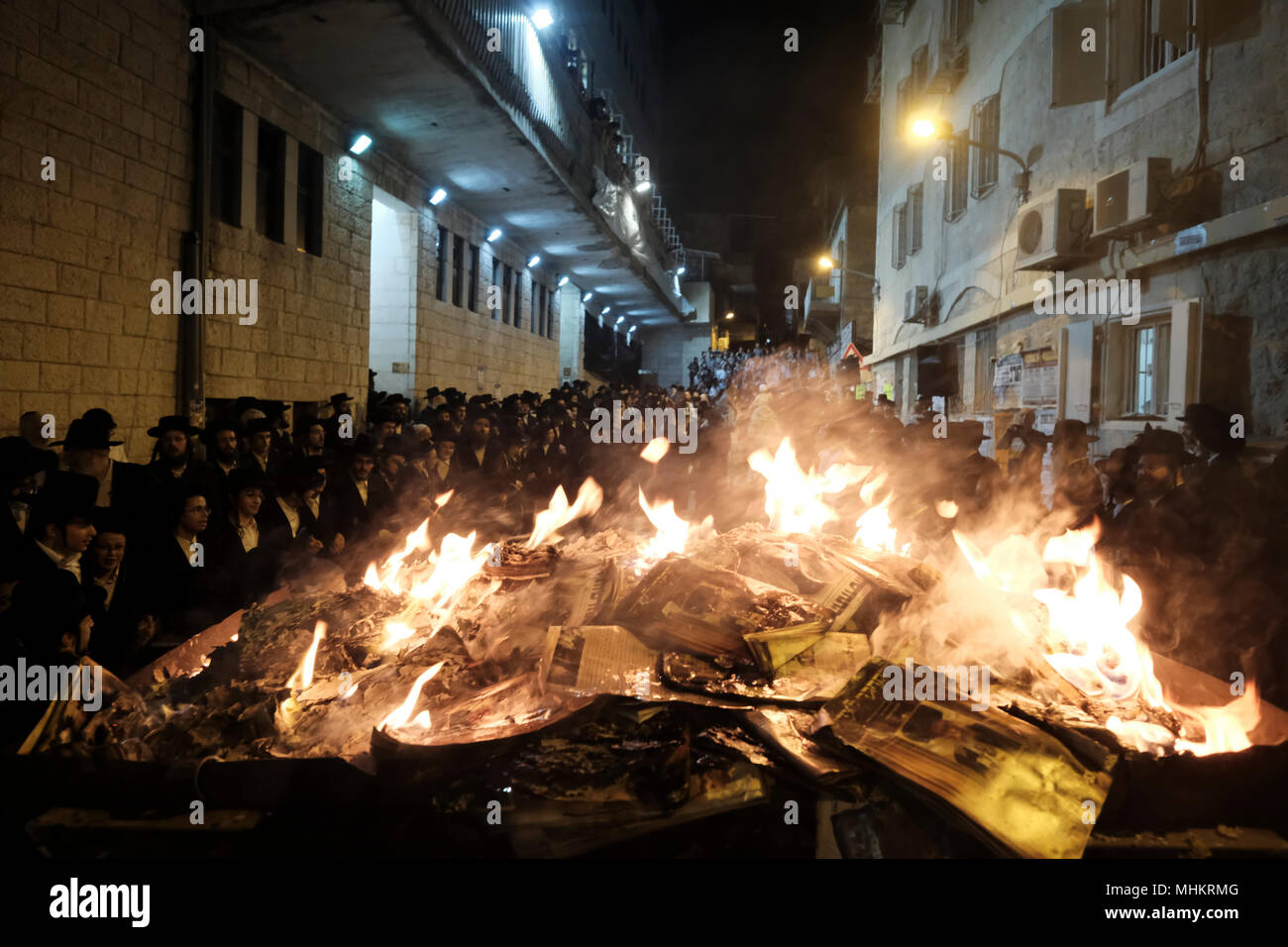 Haredi Jews dance as they light a giant oil fire in Mea Shearim ...