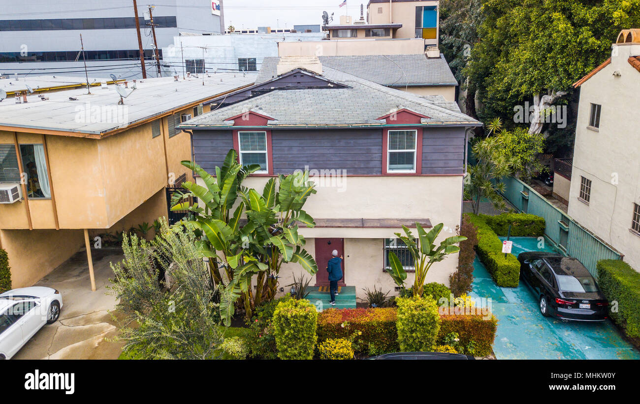 Person entering house hi-res stock photography and images - Alamy