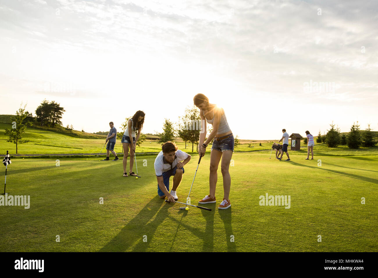 Group friends practicing golf hi-res stock photography and images - Alamy
