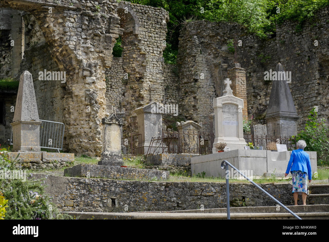 An old woman stands in an old graveyard, Livron-sur-Drôme, France Stock ...