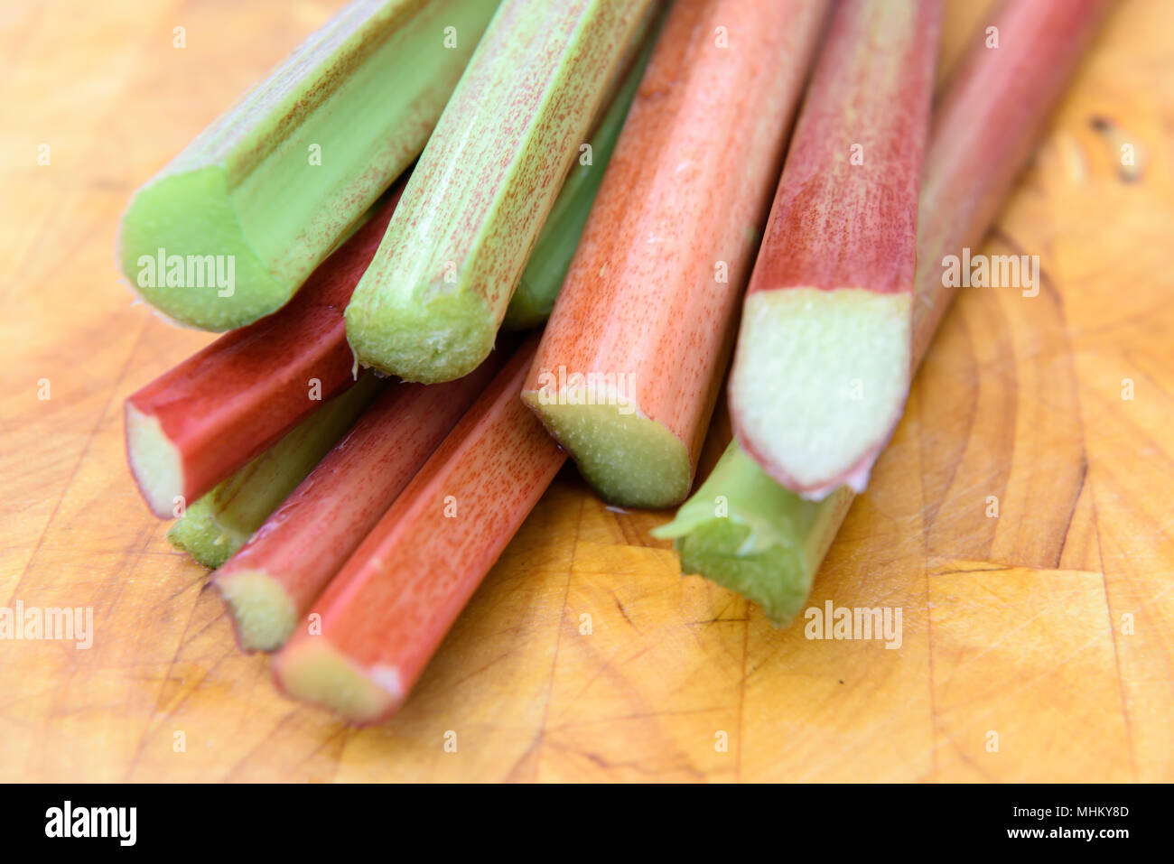 Fresh raw Rhubarb fruit with brown background Stock Photo - Alamy