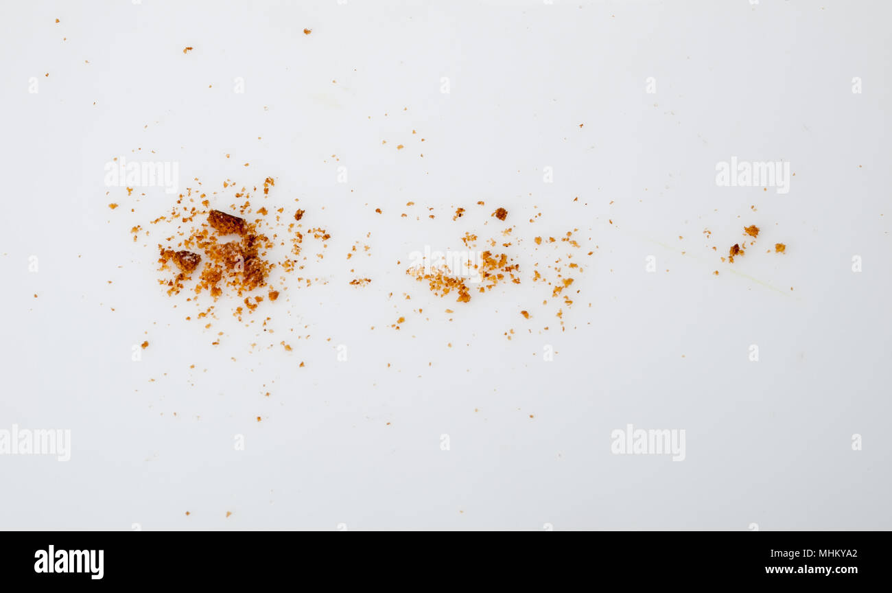 Scattered crumbs isolated on white background Stock Photo - Alamy
