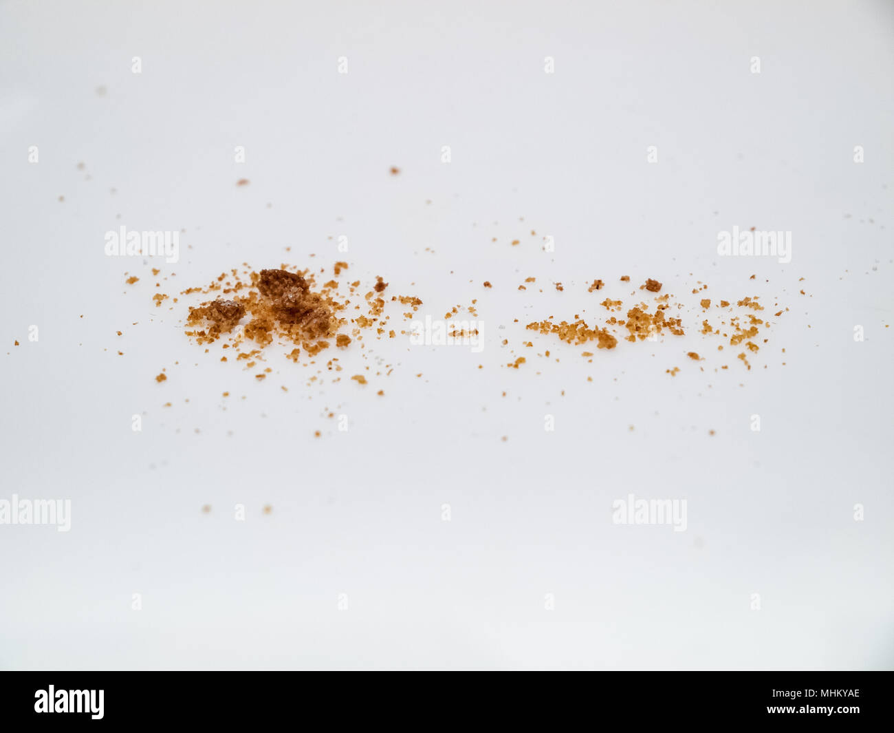 Scattered crumbs isolated on white background Stock Photo - Alamy