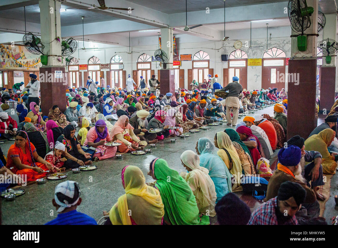 Pilgrims eating in the dinning room of Golden Temple, Each day the ...