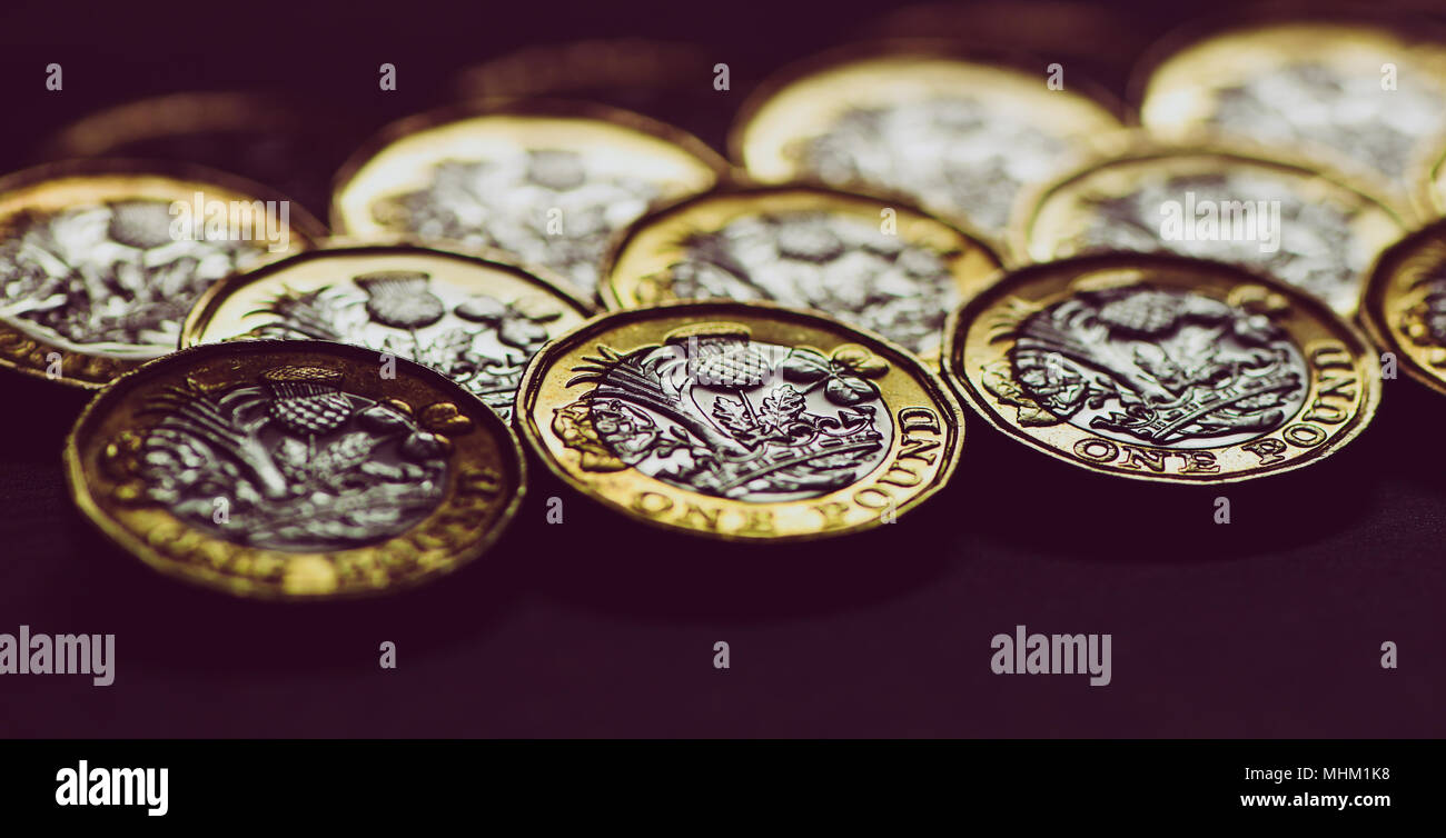 New pound coins currency lined up in pattern. Finance and business ...
