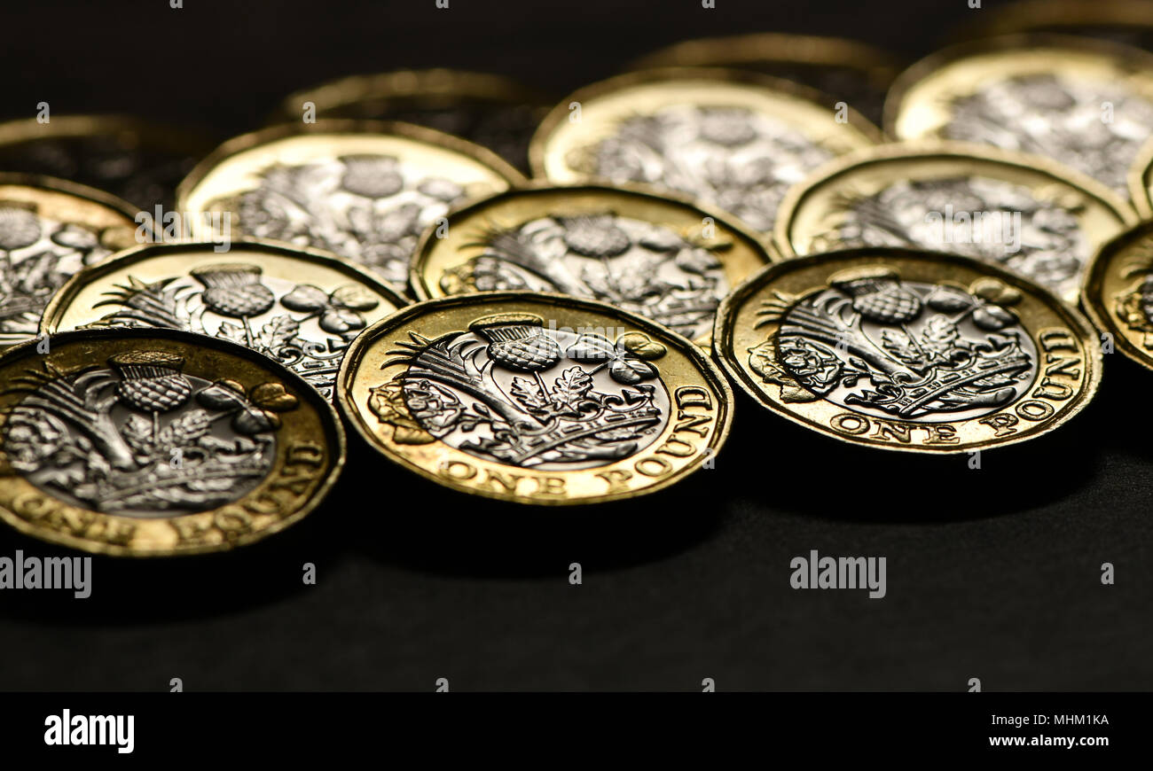 New pound coins currency lined up in pattern. Finance and business ...