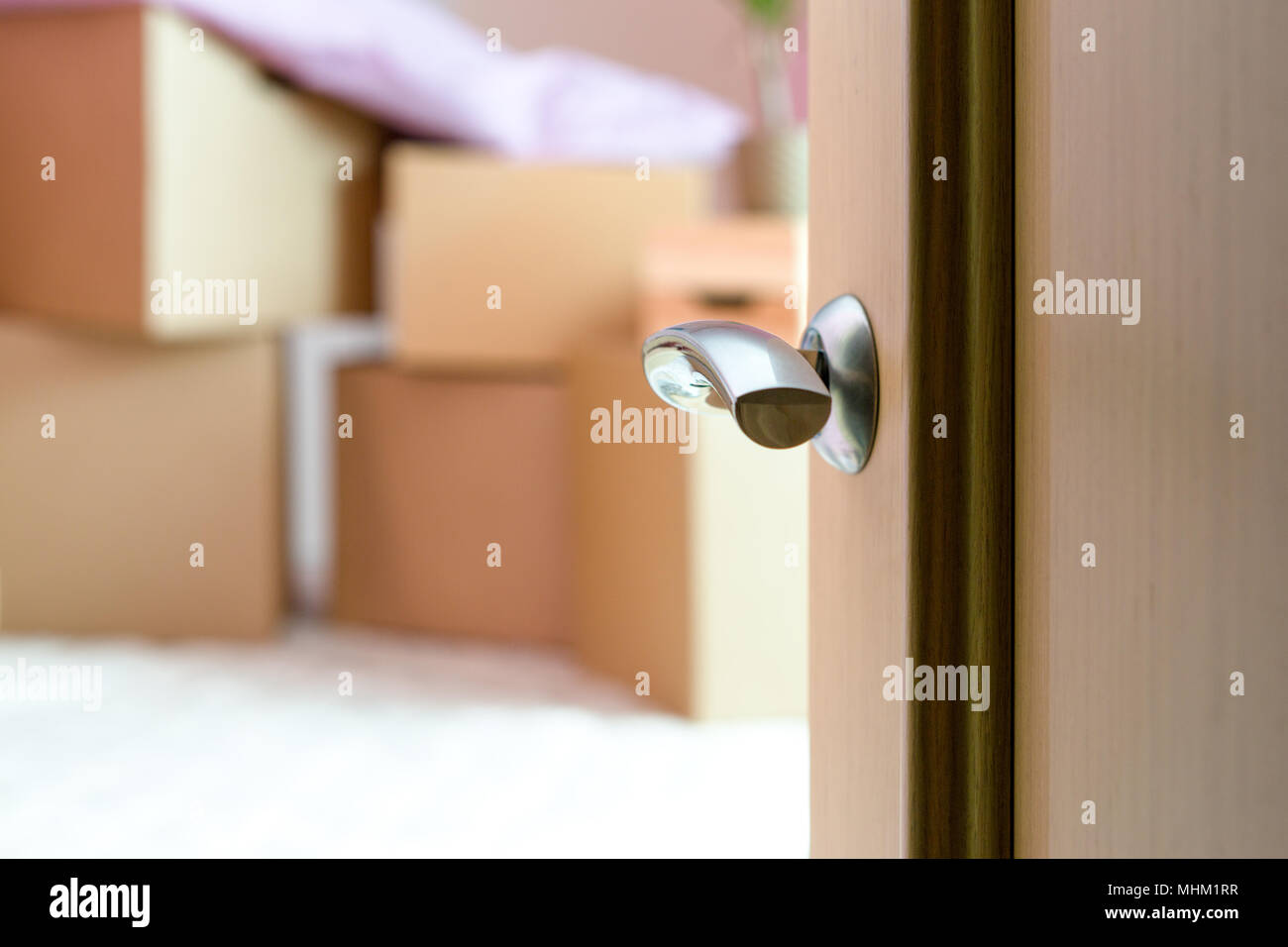 Photo of cardboard boxes, open door in new apartment Stock Photo - Alamy