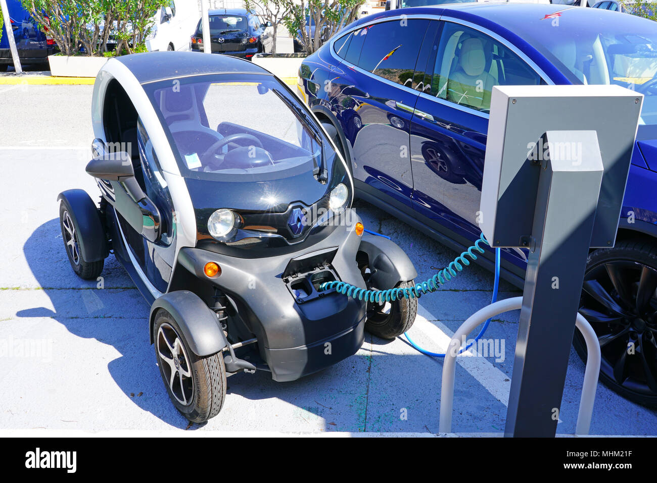 View of a mini electric car by Renault charging in the seaside resort ...