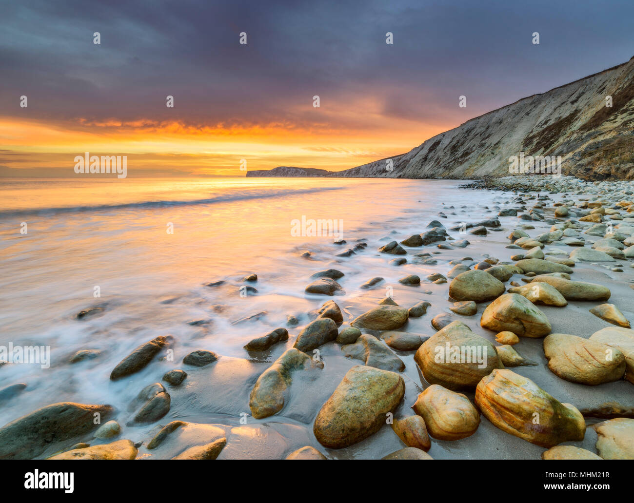 Sunset over the coast, sea and rocks at Compton Bay Stock Photo - Alamy