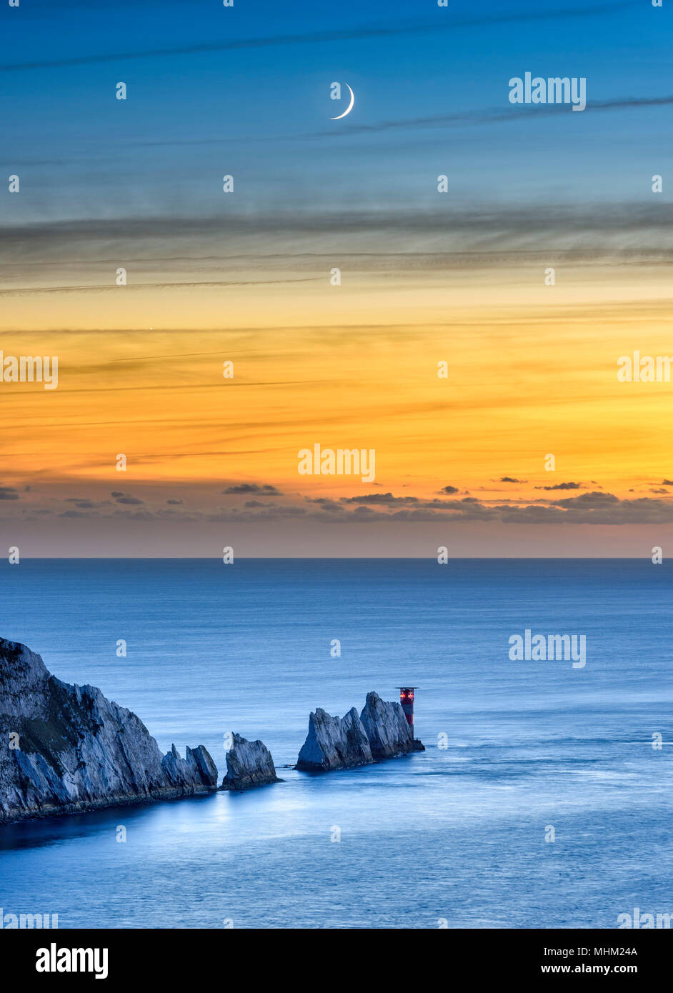 Crescent moon over the sea at the Needles Stock Photo - Alamy